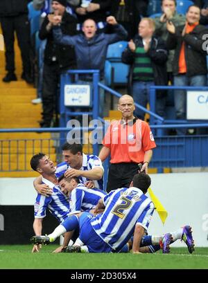 Sheffield Wednesday's Gary Madine (left) is congratulated at full time ...