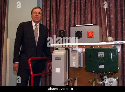 Professor John Uff explains train safety equipment during a press ...