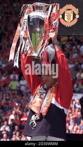 The FA Carling Premiership trophy, with ribbons tied in red , white and ...