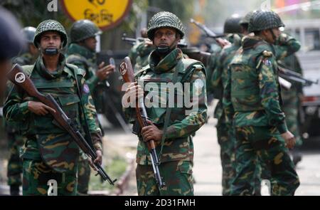 DHAKA, BANGLADESH- FEBRUARY 27, 2009: Bangladesh Army solders stand ...