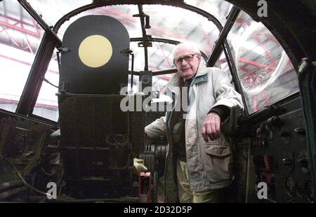 Peter George, 1st Officer with the Air Transport Auxiliary, sits in the ...