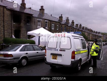 A police officer stands between people arguing next to an anti-Iranian ...