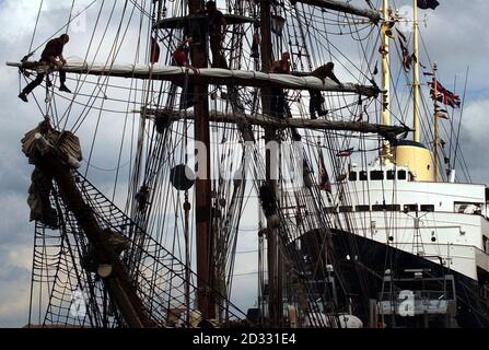 The crew of the tall ship Astrid tie up the sails in front of the Royal ...
