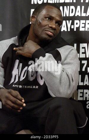 World Heavyweight boxing Champion, Hasim Rahman (left) stands with ...