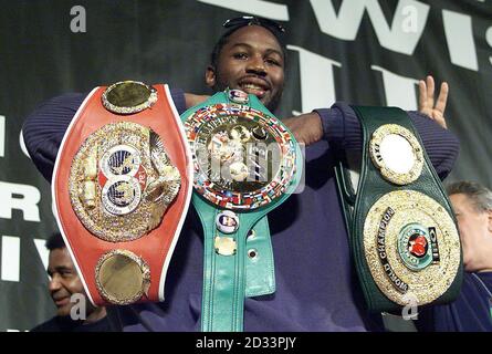 Lennox Lewis holds up the WBC Heavyweight title belt Stock Photo - Alamy