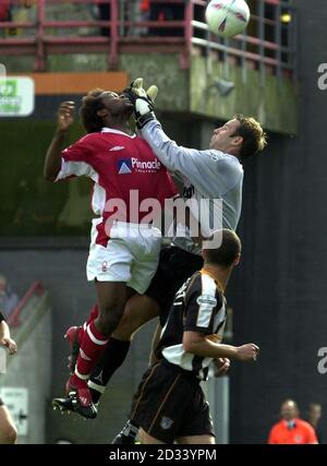 Grimsby Town's goalkeeper Danny Coyne (left) and Tony Gallimore ...