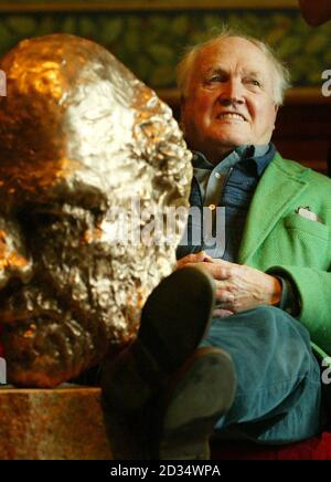 Artist George Wylie with one of his sculptures during a preview for a ...