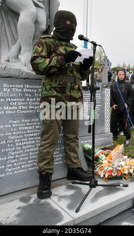 A masked Real IRA man appears from the crowd to read a statement, at a ...