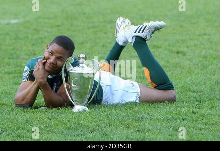 South Africa's Ryno Benjamin poses with the trophy during day two of ...