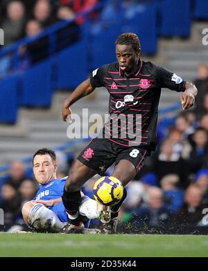 Chelsea's John Terry, left, challenges for the ball with Ashley Cole ...