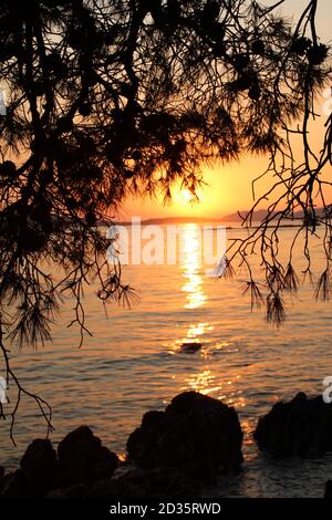 A vertical shot of sunset over the sea in Gran Canaria, Canary Islands ...