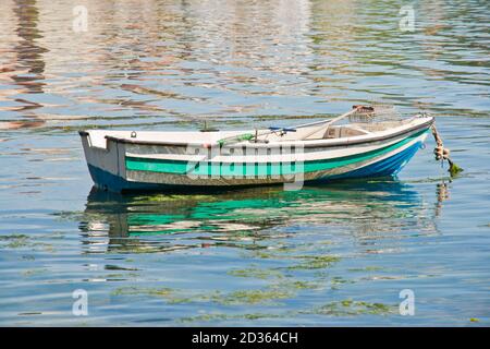 Small wooden colored boat parked near the seashore Stock Photo - Alamy