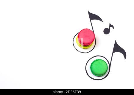 Sweet music creative background. Macaroon and hand drawn music notes on ...