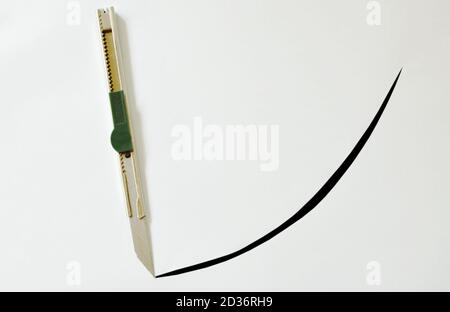 cutter blade curve slashing on white paper background Stock Photo - Alamy