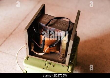 Old custom laminated core transformer 220V to 110V, interior view, iron ...
