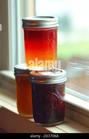 Jars of homemade jam on window sill Stock Photo - Alamy