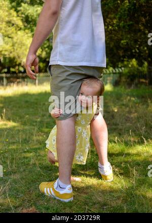 Looking between his legs Stock Photo - Alamy