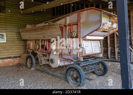 A Marshall thrashing machine on display at Cressing Temple Barns, an ...