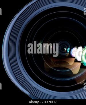 Optical partial sight. Reflection in the photo, camera on orange ...