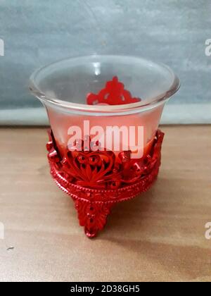 Red candle in glass stand. Isolated on white background Stock Photo - Alamy