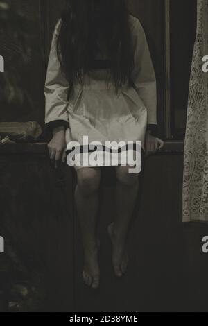 Demon possessed little girl at night. Mad scary girl at dark night ...