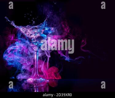 red splashing cocktail on black Stock Photo - Alamy