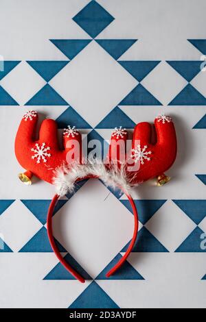 Christmas reindeer horns on blue background Stock Photo - Alamy