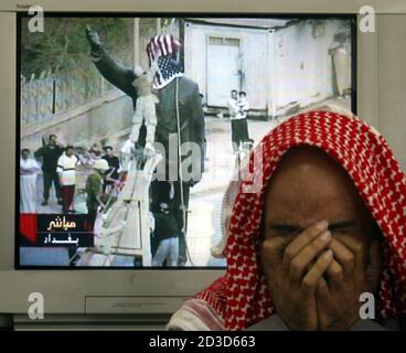 A statue of Iraqi president Saddam Hussein in military outfit in ...