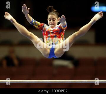 Romanian gymnast performs on bars at a gymnastics competition Stock ...