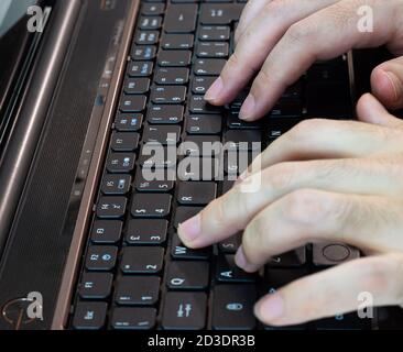 Hand man using keyboard computer laptop mock up blank white screen ...