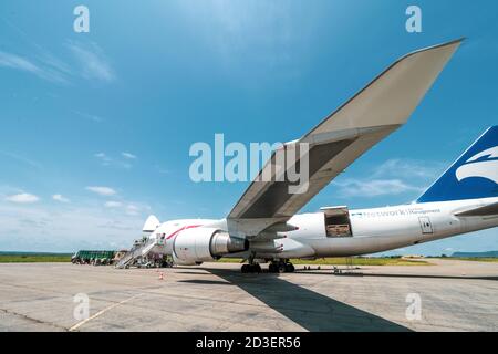 nose cargo loading door of a Boeing 747-200F opening at dawn Stock ...