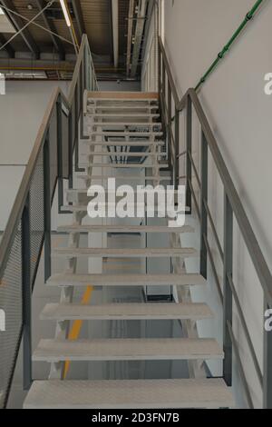 Stairs in a car workshop with exit markings Stock Photo - Alamy