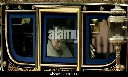 Queen Elizabeth II looks out of the window of Buckingham Palace, in ...
