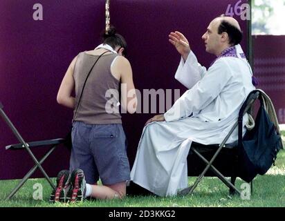 Catholic priest hearing a confession Stock Photo - Alamy