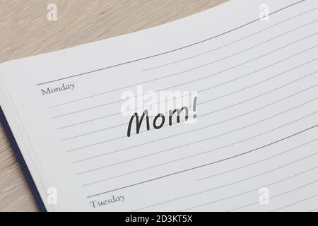 A Mom reminder note in a diary page Stock Photo - Alamy
