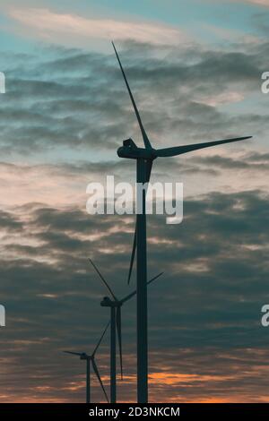 Windmill in the sunset of Uruguay Stock Photo - Alamy
