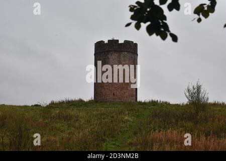 Castle windmill on hill in Scotland Stock Photo - Alamy