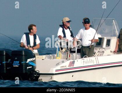 President George W. Bush fishes with his father, former President ...