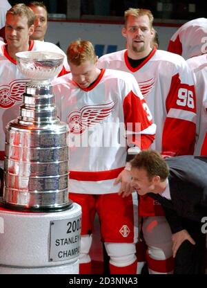 Former Detroit Red Wing Nicklas Lidstrom points to the retired numbers ...