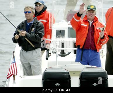 President George W. Bush fishes with his father, former President ...