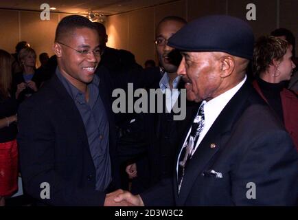 Actor Cuba Gooding Jr. greets retired Sen. Bob Dole (R-KS) as they ...