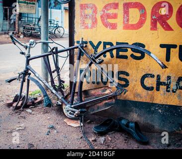 A closeup shot of a damaged and old bicycle on the ground Stock Photo ...