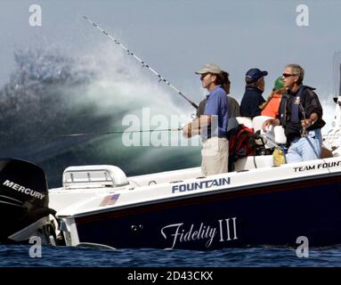 President George W. Bush fishes with his father, former President ...