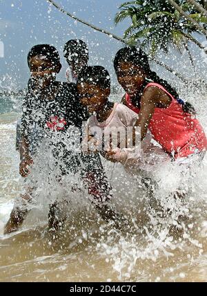 Akurala Beach, Sri Lanka - DECEMBER 2015 - Native fishermen reel in a ...