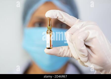 A selective focus shot of face mask on a statue - concept of the new ...