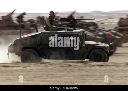 Humvee military vehicles of the US Marine, armed with heavy machine ...