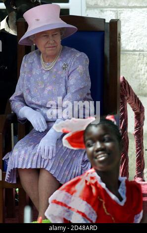 Queen Elizabeth II watches a dance display by students from Langdon ...