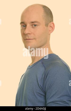 Close up profile view of bald senior man against white background Stock ...