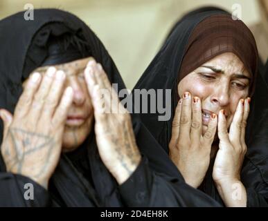 A fire victim, the Iraqi three-year-old girl Maryam and her foster ...
