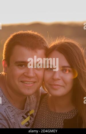 Close lifestyle portrait of embracing in city square, authentic image ...